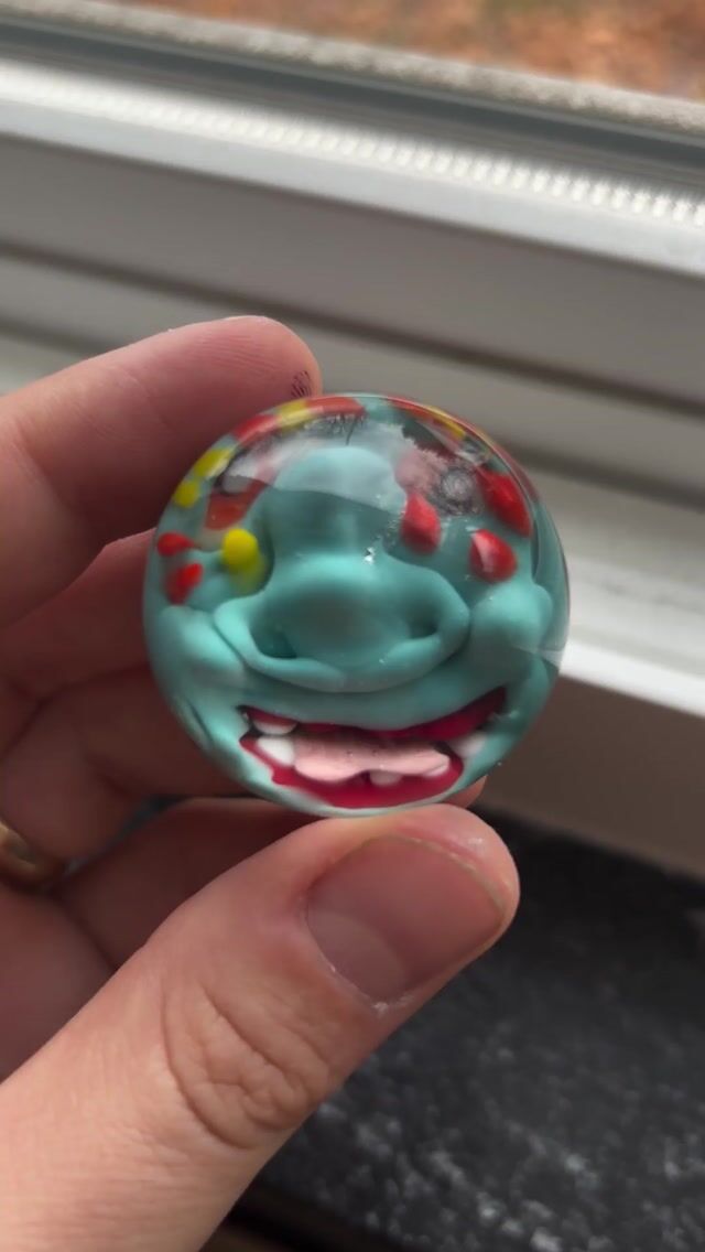 Blue smushed face marble | Shop Marbles on GlassPass